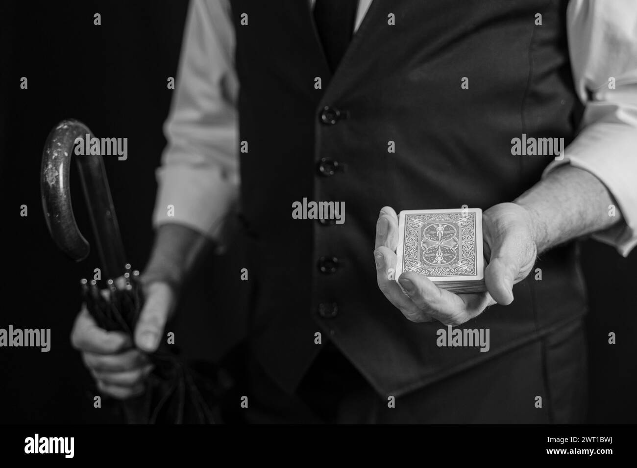 Pack of playing cards hand Black and White Stock Photos & Images - Alamy