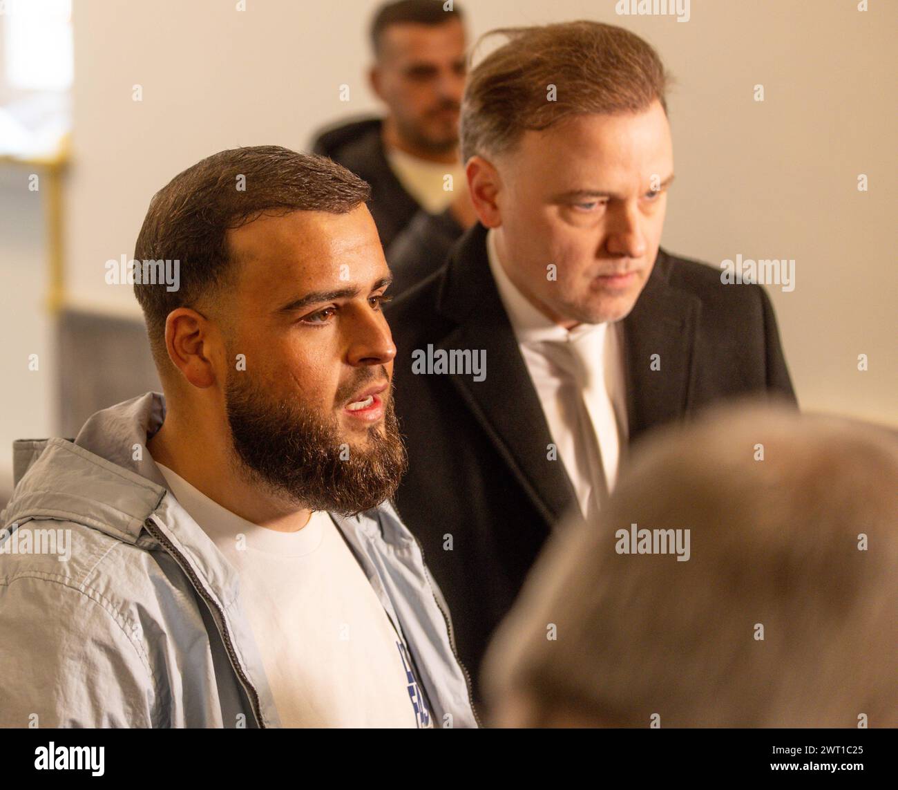 Dortmund, Germany. 15th Mar, 2024. Rapper Fat Comedy (l) stands next to ...