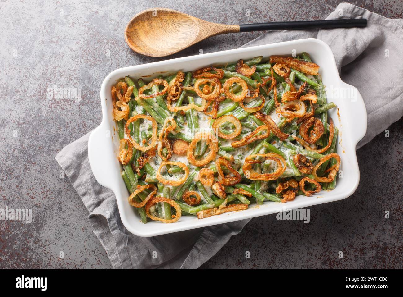 Homemade Green Bean Casserole with crispy fried onions on the baking ...