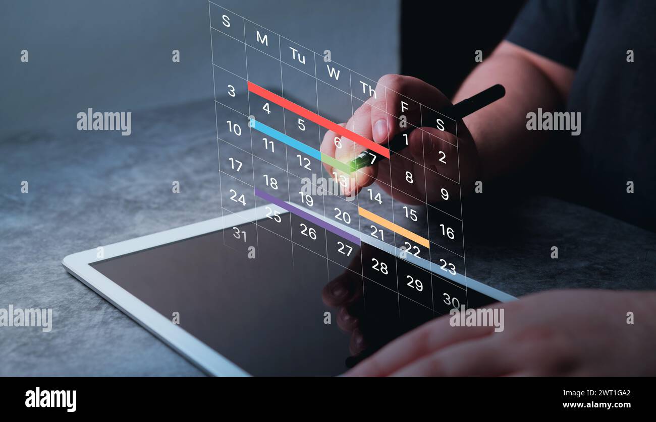 Woman use digital tablet to mark dates on virtual hologram calendar ...