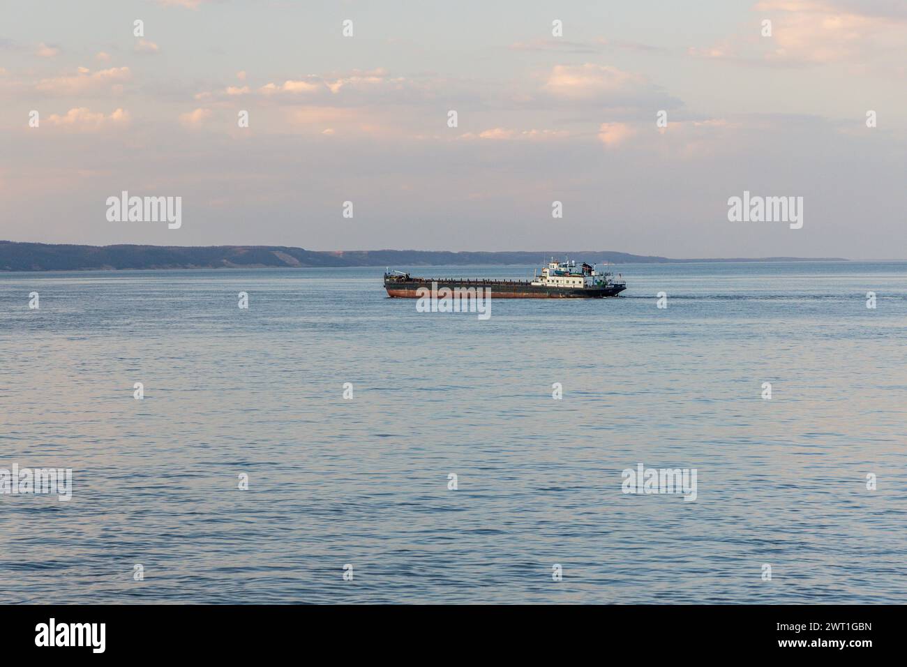 Tetyushi, Tatarstan - May 2, 2022: A large black cargo ship is moving ...