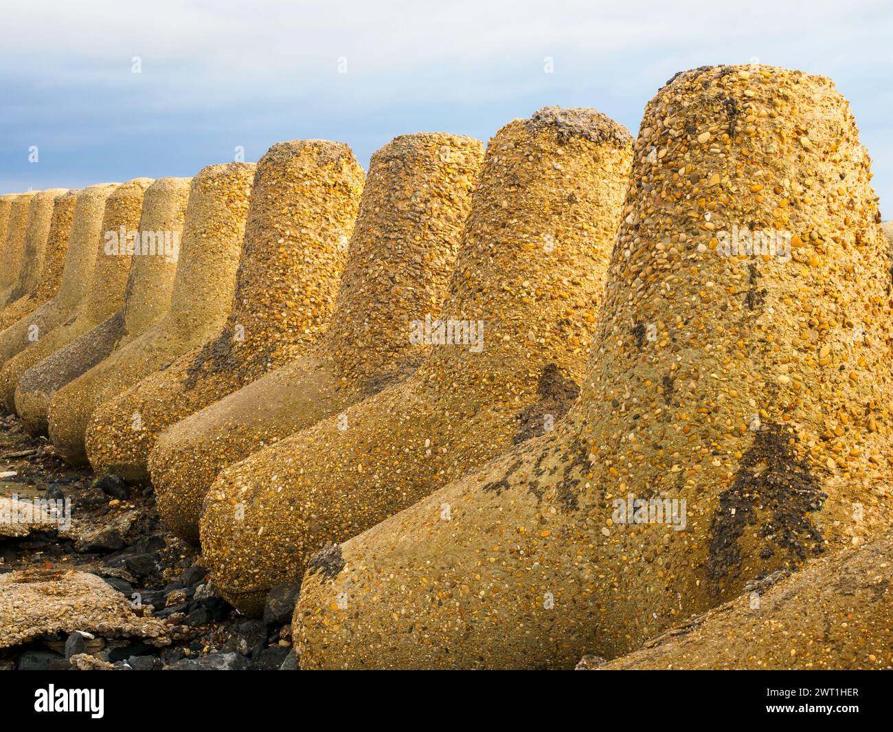 Concrete breakwater near the old lighthouse of Fiumicino - Rome, Italy ...