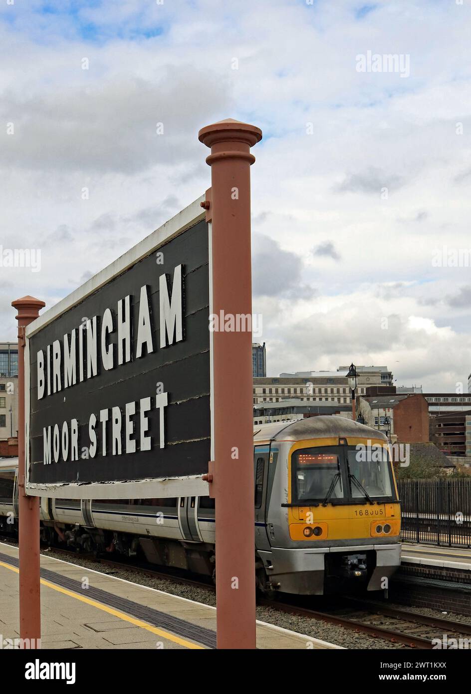 A Chiltern train hiding behind an old Great Western Railway sign at ...