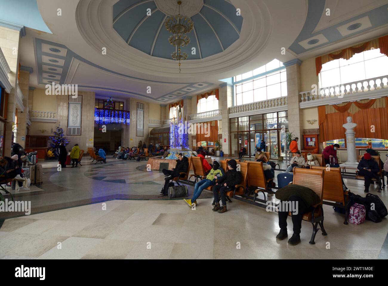 Passengers sitting on benches in the waiting room of the Uzhgorod ...