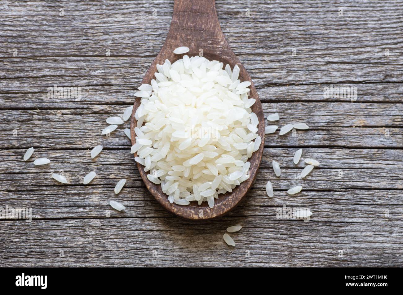 turkish raw white rice grains in bowl or spoon on table, healthy food ...