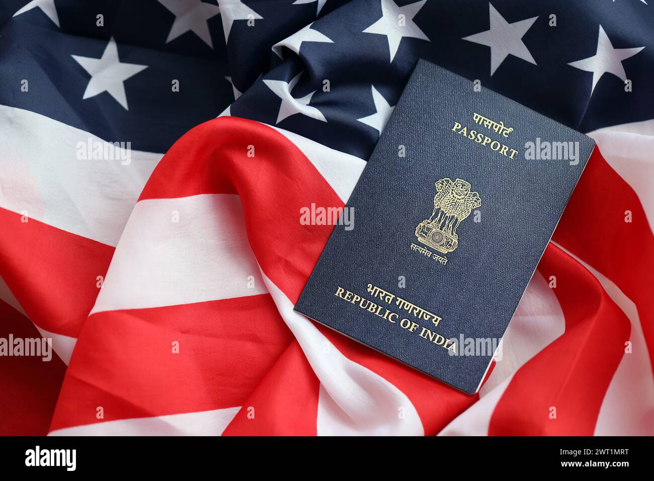 Blue Indian Passport On United States National Flag Background Close Up Tourism And Diplomacy