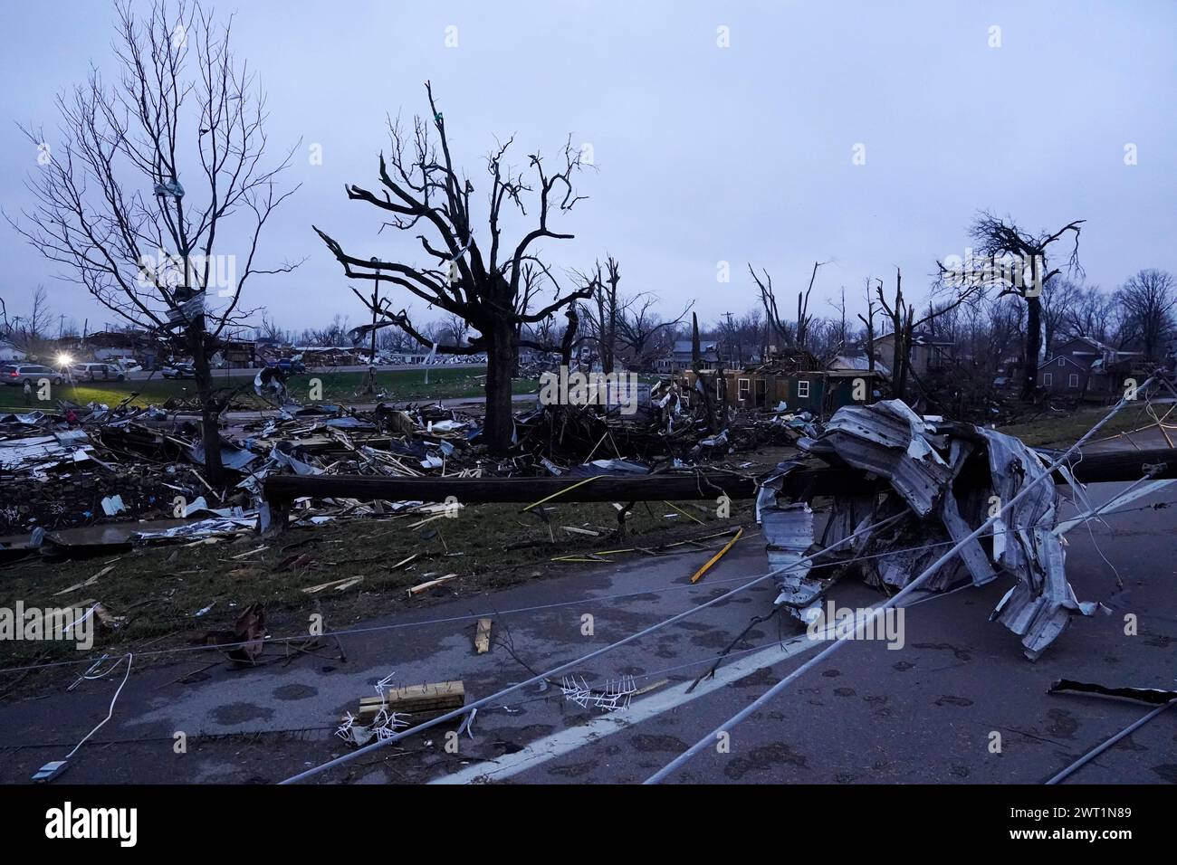 Debris from severe storms scatters the ground Friday, March 15, 2024 ...