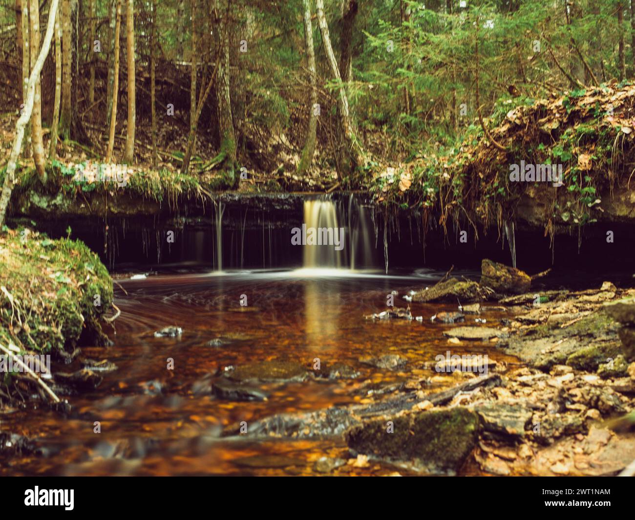 Through the art of long exposure, Olupite Waterfall transforms into a ...
