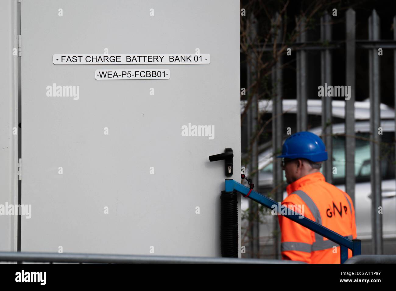A worker near a fast charge battery bank during the demonstration for ...