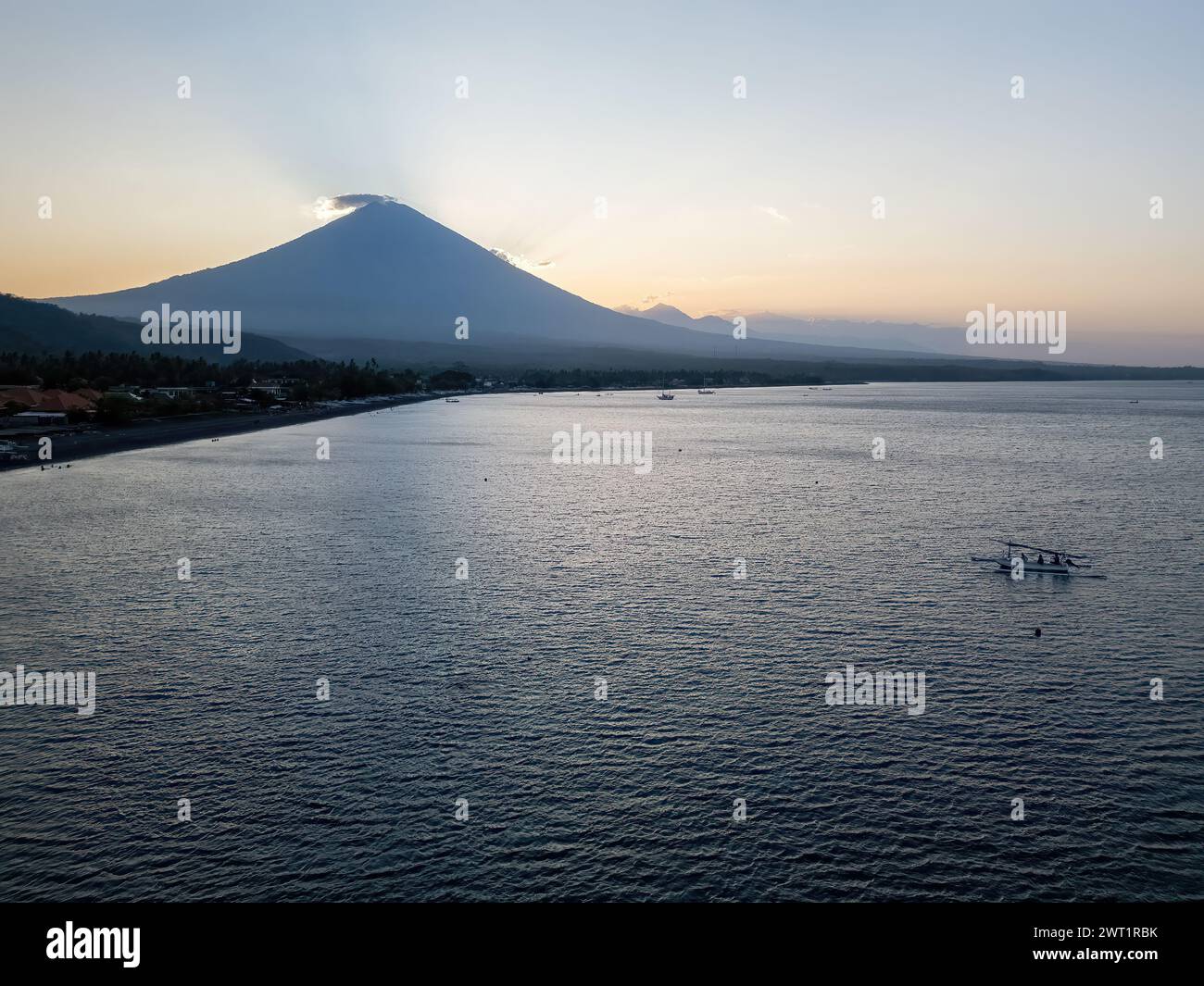 Bay with volcano, sea, beach and city in Bali at evening, drone photo ...