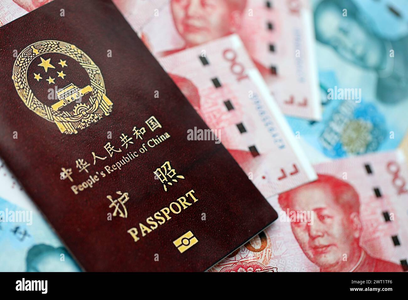 Red passport of People Republic of China and chinese yuan money bills ...