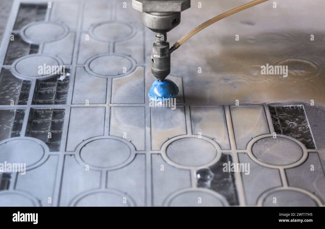 High pressure water jet cutting metal plate Stock Photo - Alamy