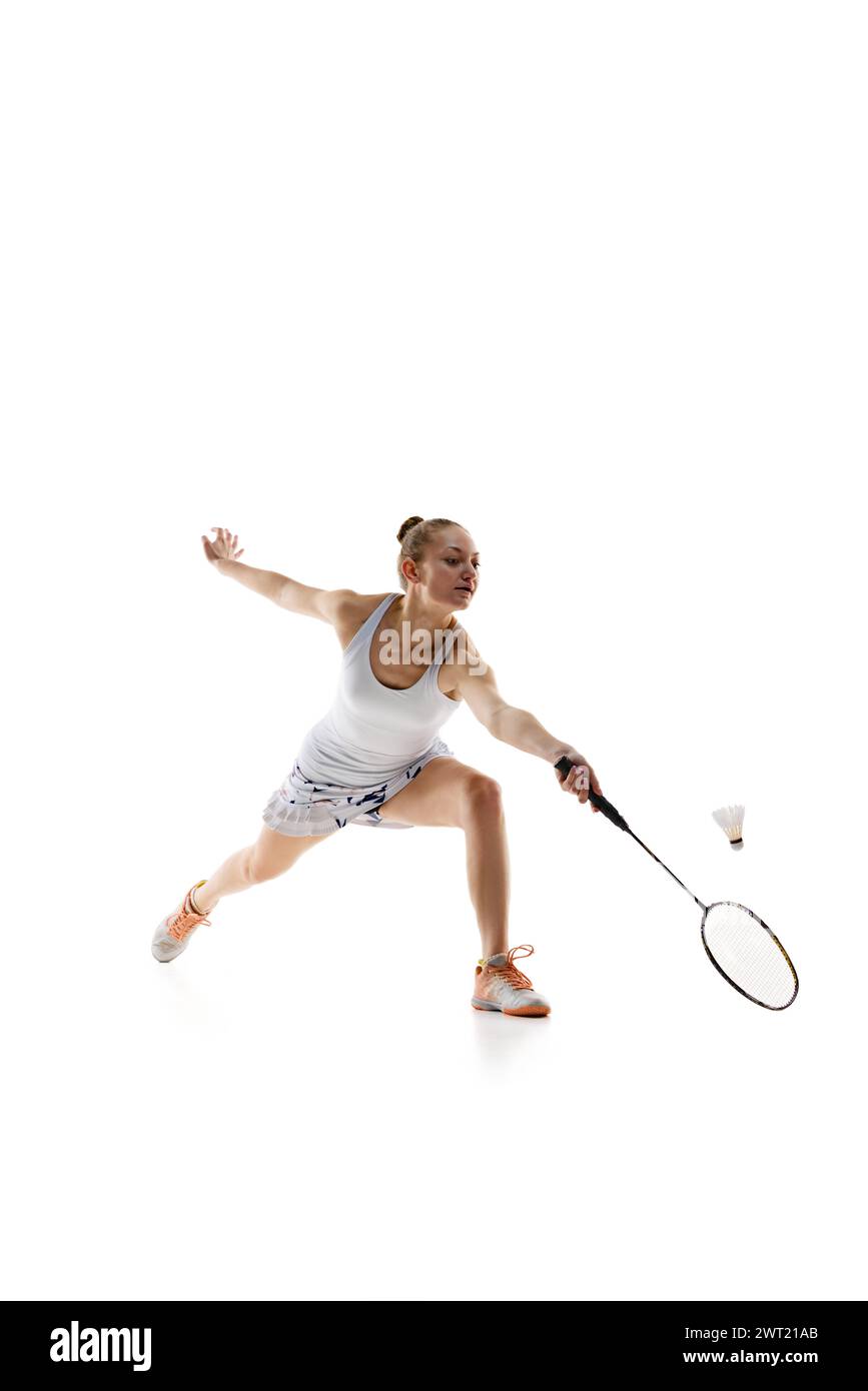 Concentrated young girl, athlete in motion with racket, playing ...