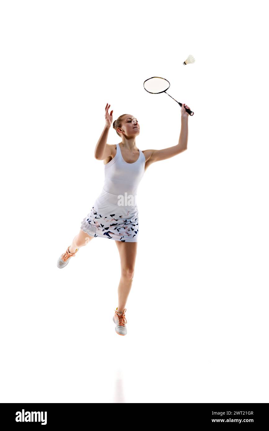 Concentrated young girl, athlete in motion with racket, playing ...
