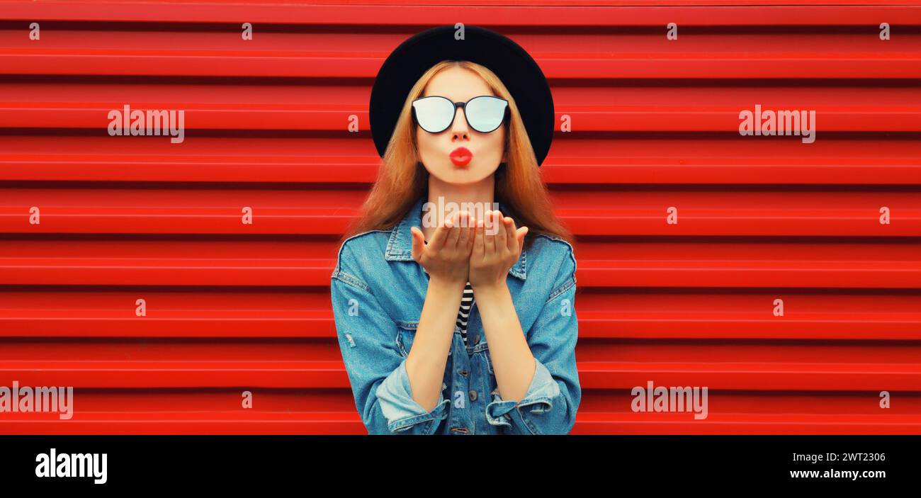 Portrait of stylish young woman model blowing her lips sending sweet ...