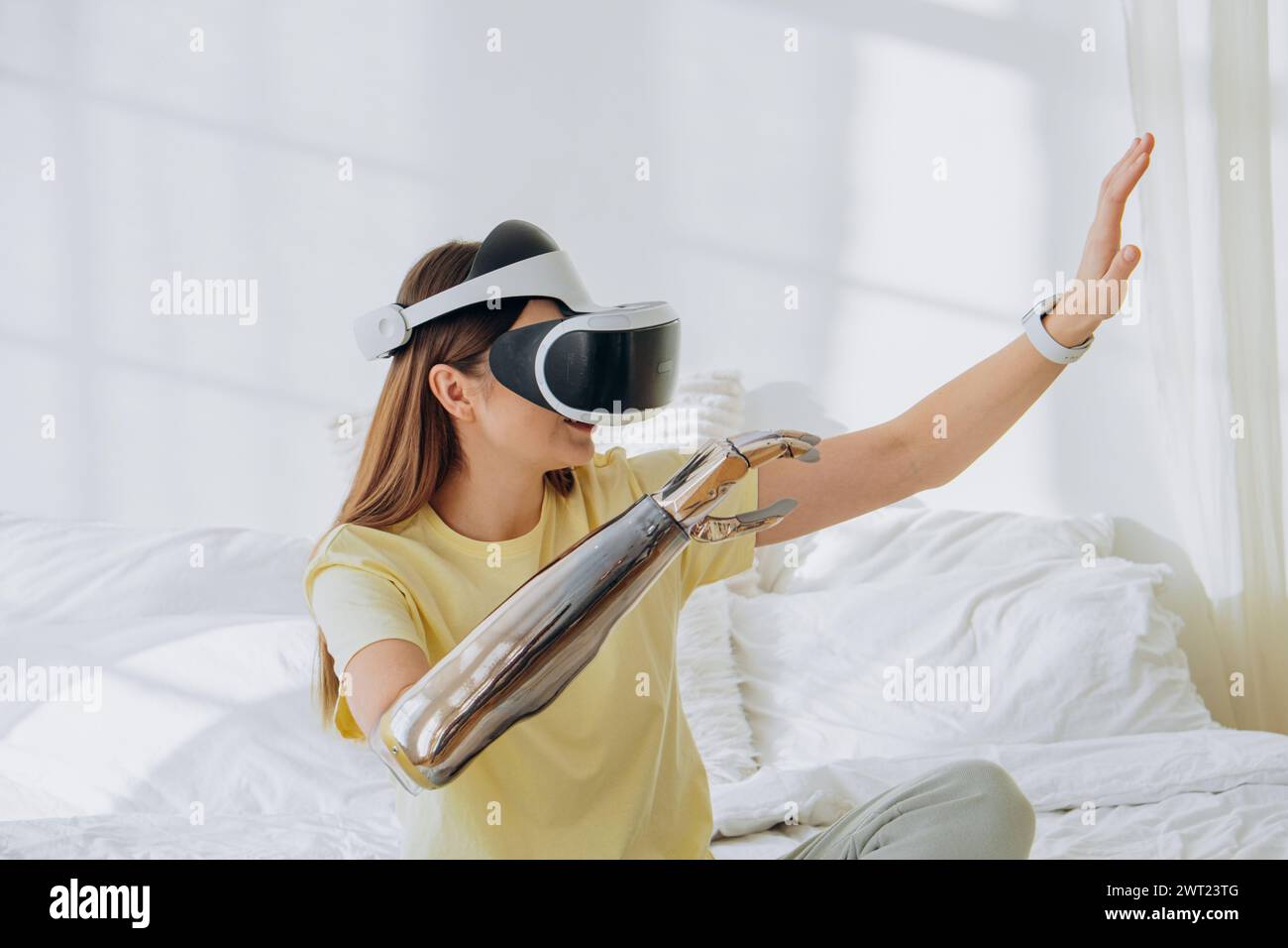 A woman explores virtual reality, wearing a VR headset and interacting with a futuristic robotic ...