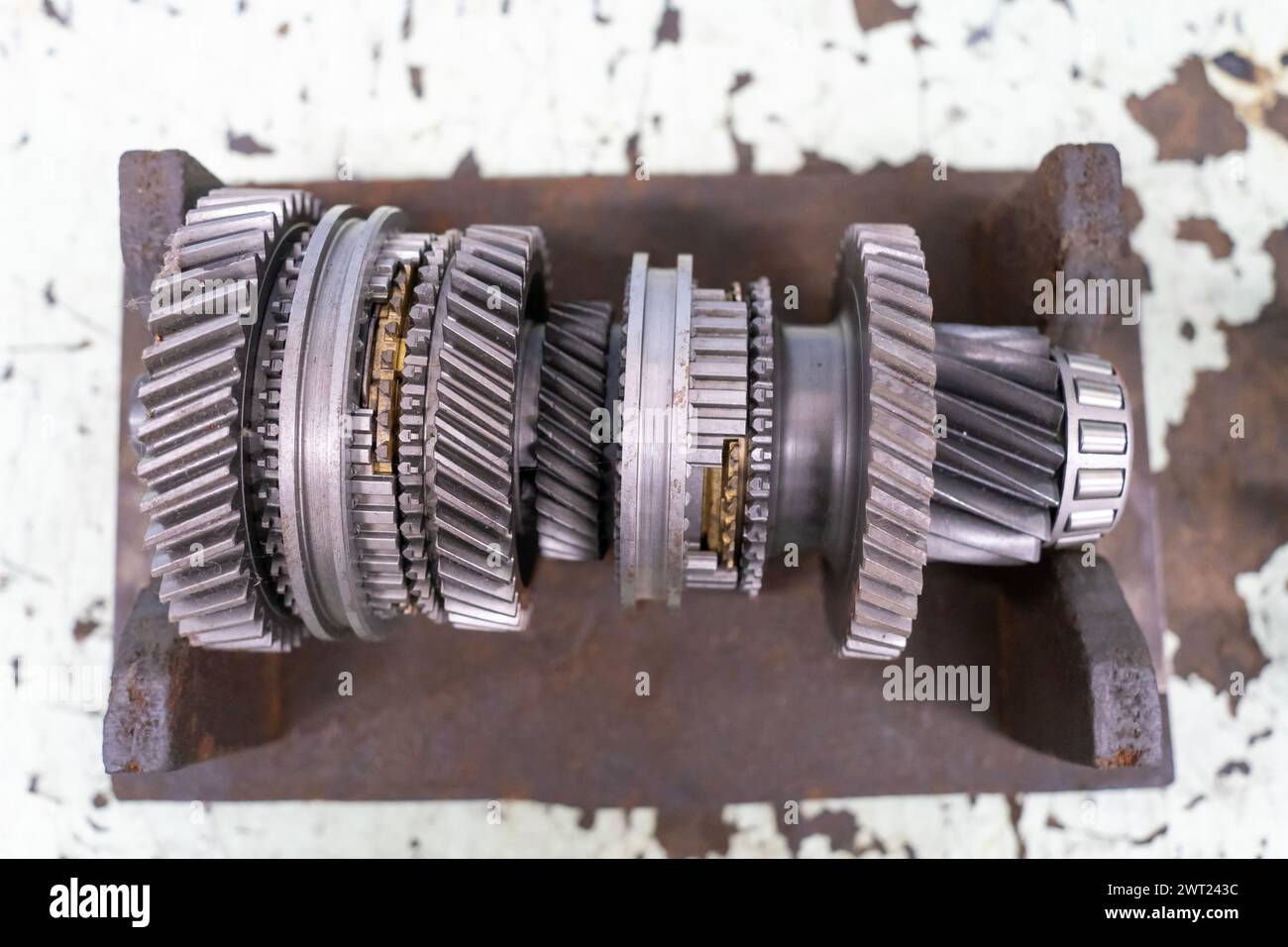 A gearbox consisting of gears of different sizes on a workbench Stock ...