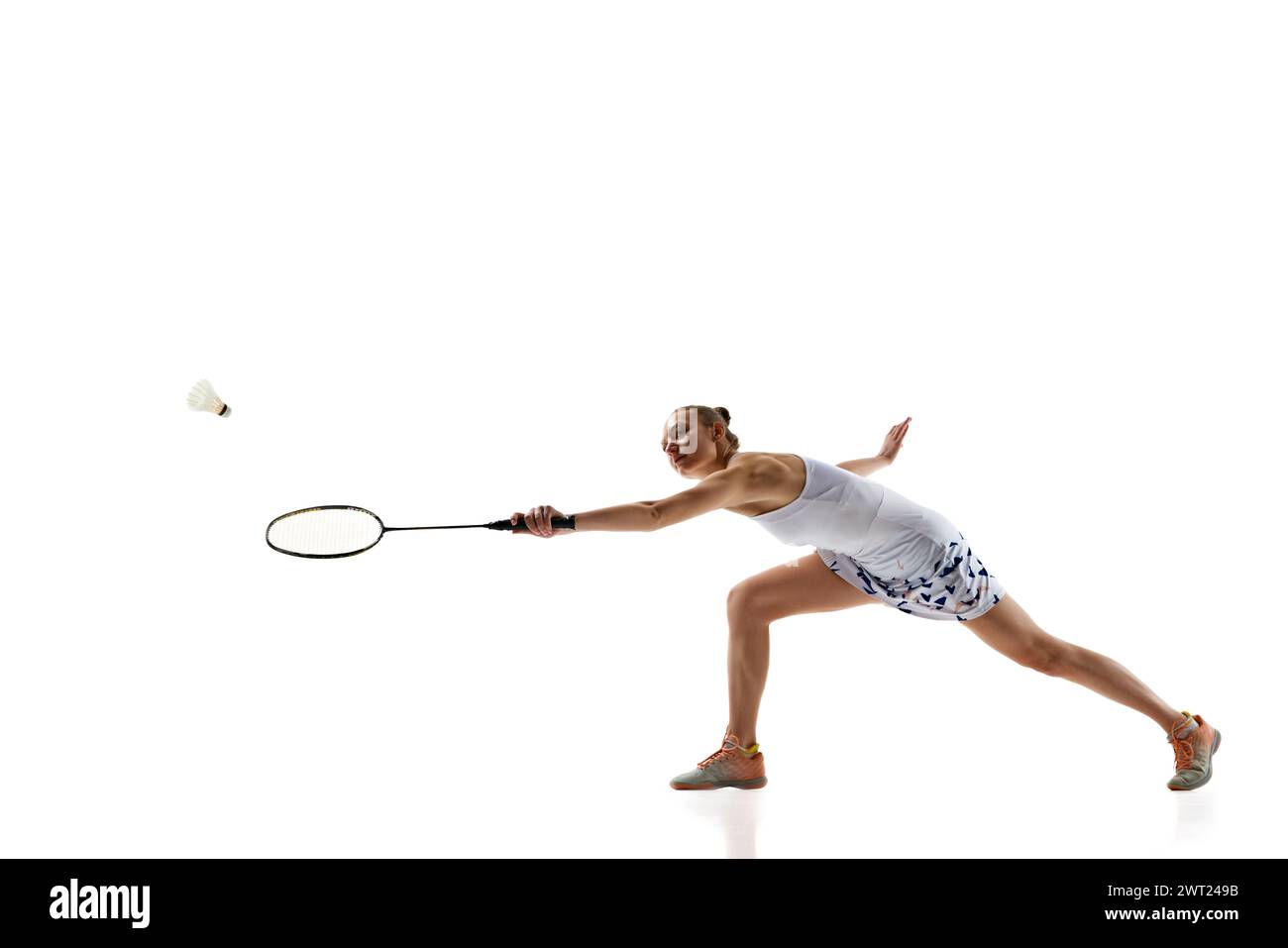Concentrated young girl, athlete in motion with racket, playing ...