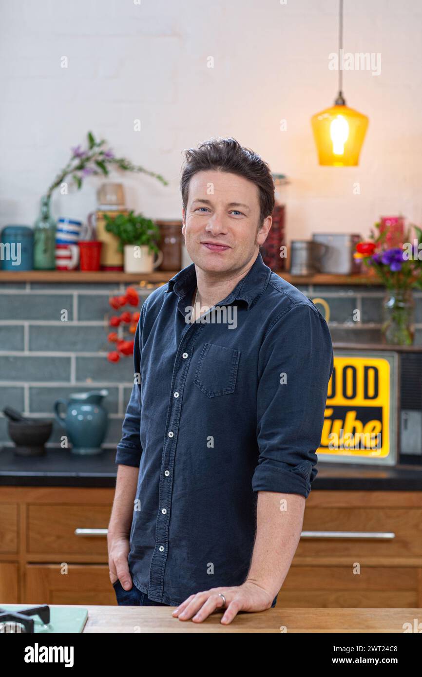 Jamie Oliver, english celebrity chef, restauranteur cooking for his ,food tube channel in London ...
