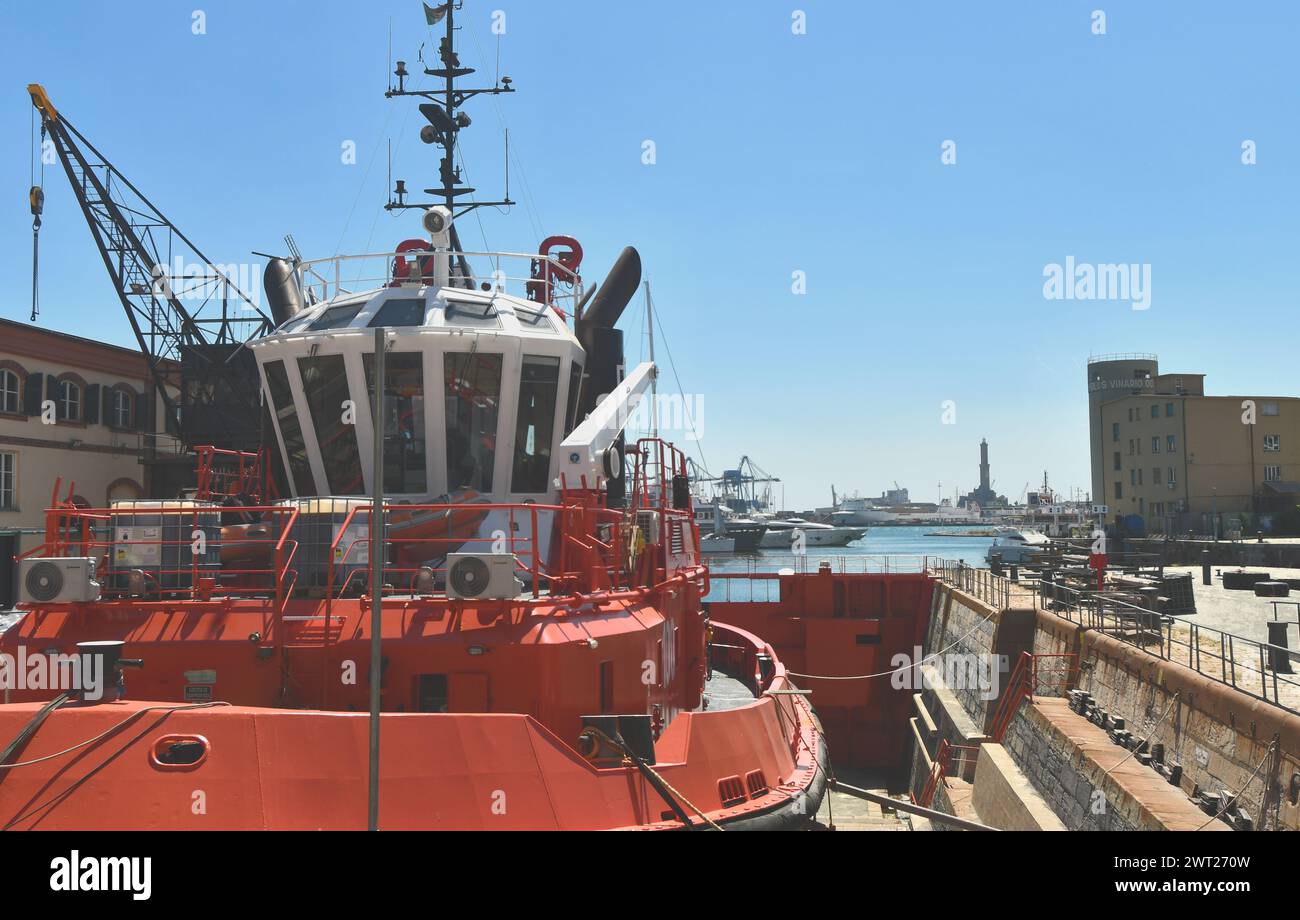 The port of Genoa is a place of great charm with large ships ...