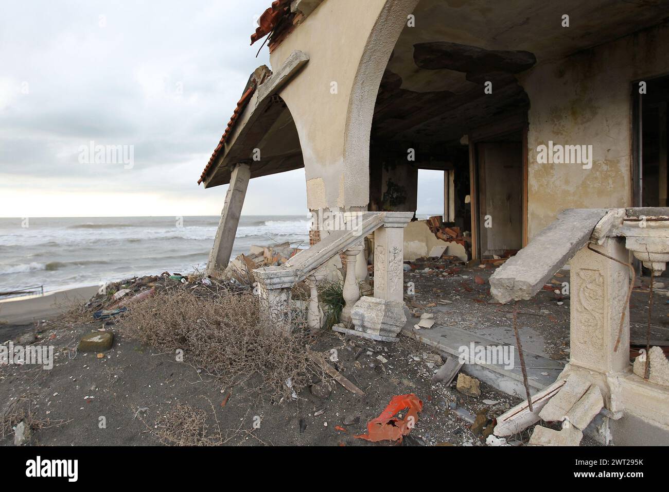 Houses, built by the sea, completely destroyed by the erosion of the ...