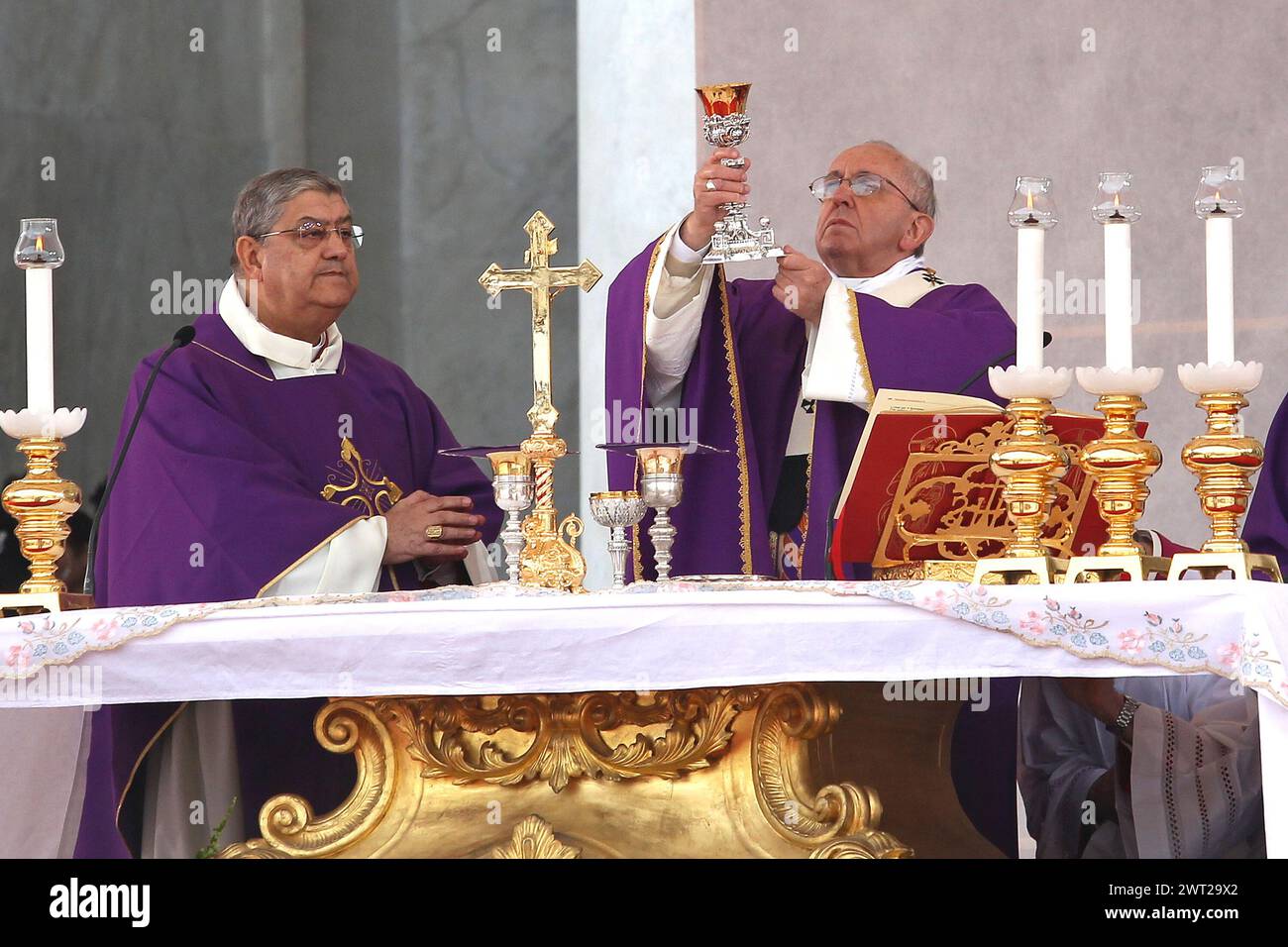Pope Francis celebrates mass with cardinal Sepe on a stage set in ...