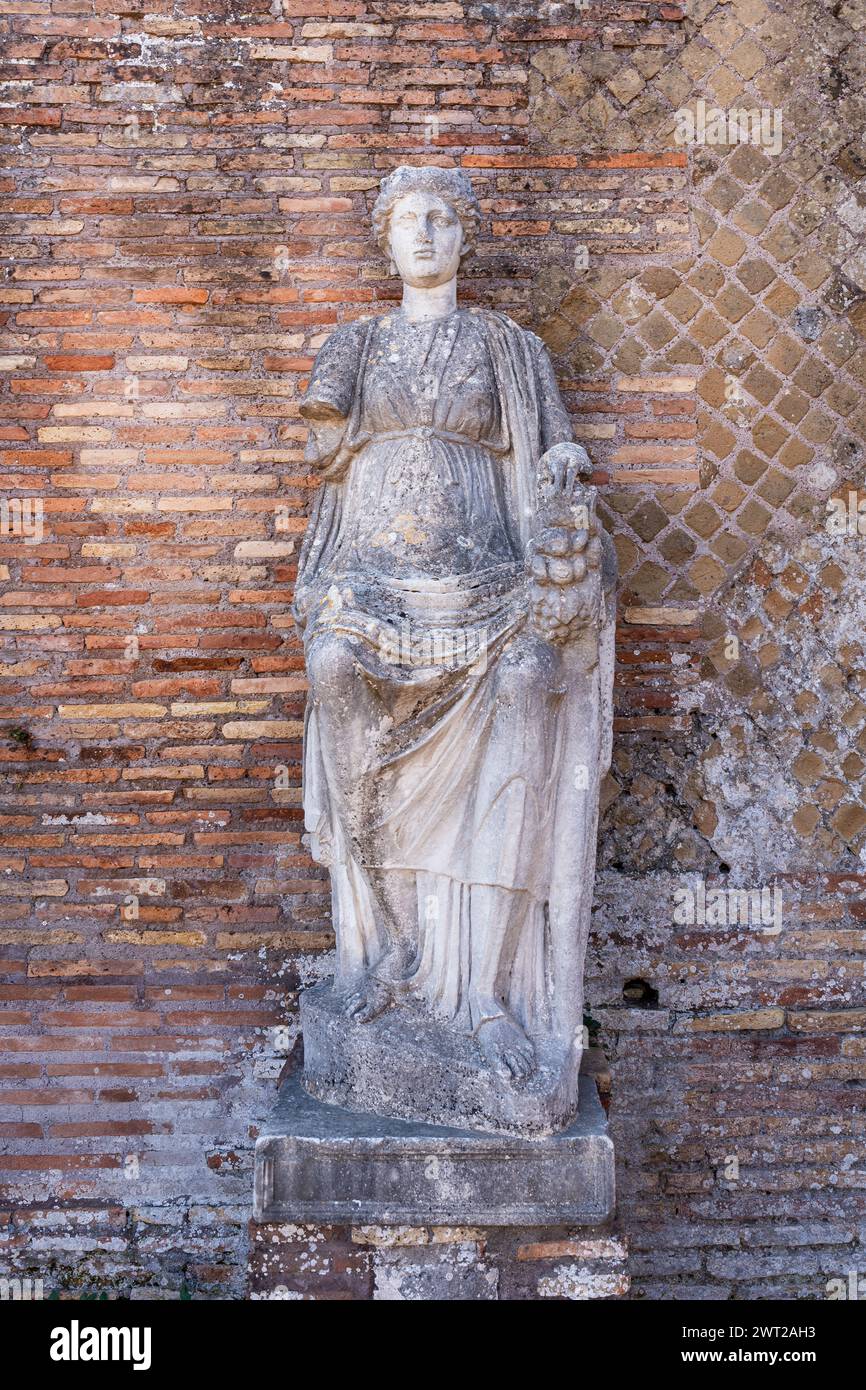 Statue in ruins portraiting an ancient roman goddess Stock Photo - Alamy