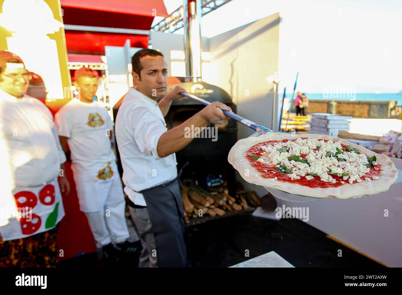 The pizza master, Gino Sorbillo, prepares a pizza on the Caracciolo ...
