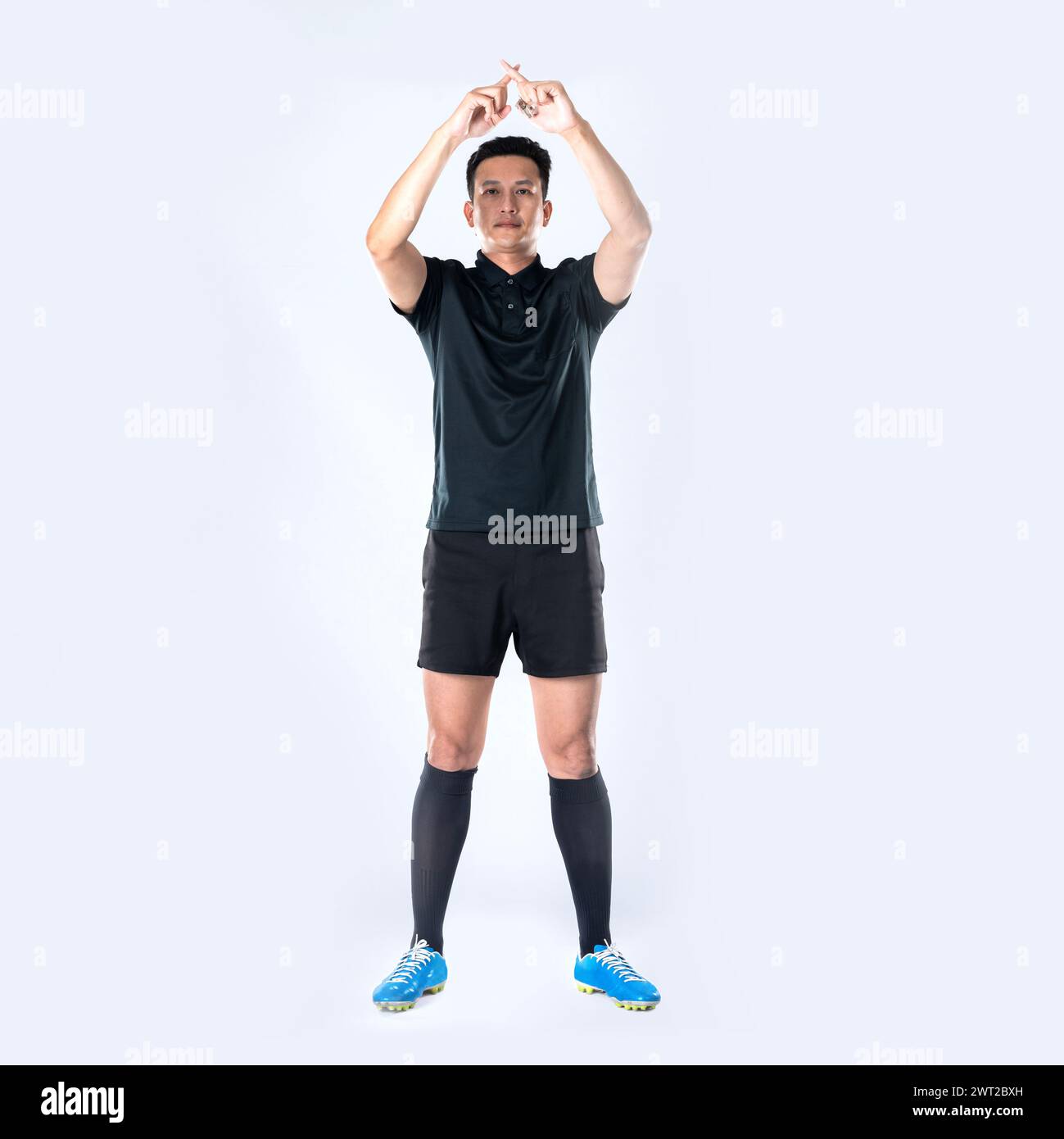 Football referee showing VAR symbol on white background Stock Photo - Alamy