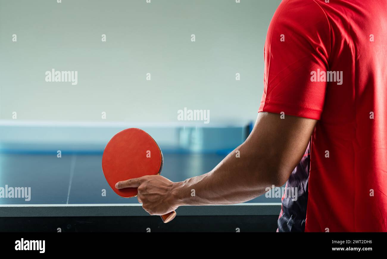 young athlete playing ping pong with determination in victory playing ...