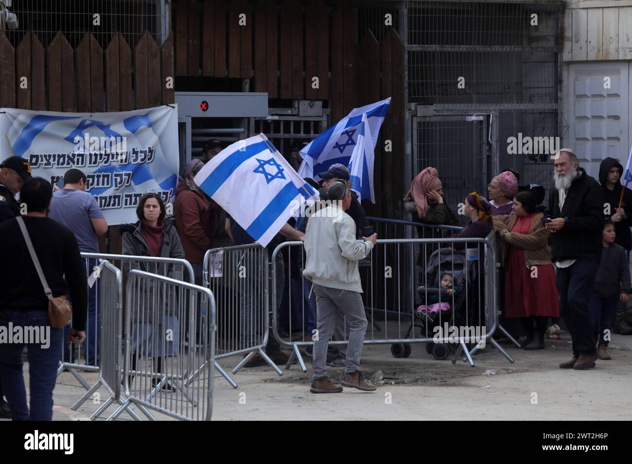 Jewish settlers, gathering in the area with Israeli flags, protested ...