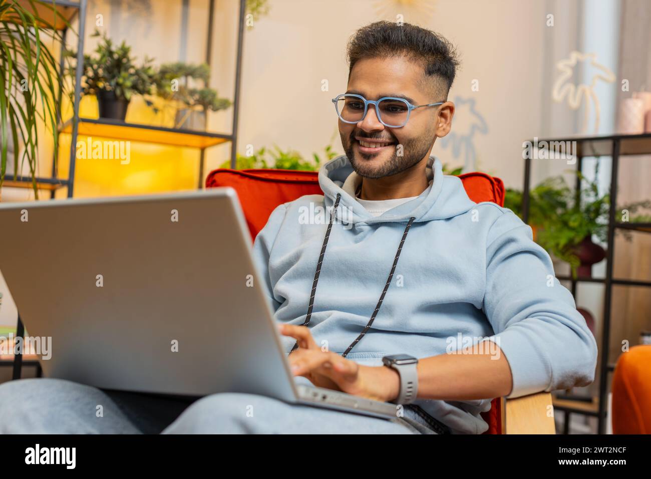 Indian man relaxing on chair hi-res stock photography and images - Alamy