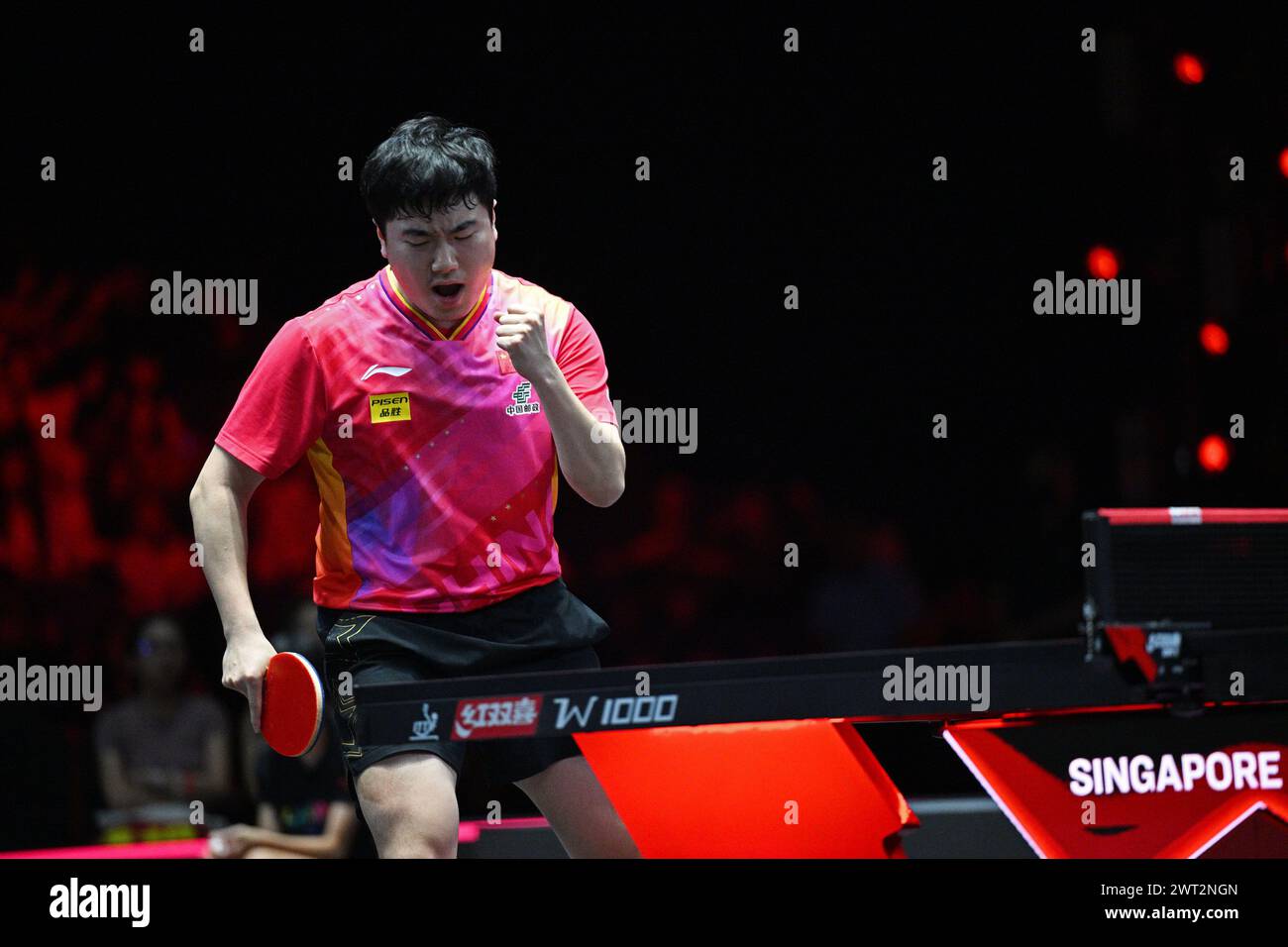 Singapore. 15th Mar, 2024. Liang Jingkun of China celebrates during the ...