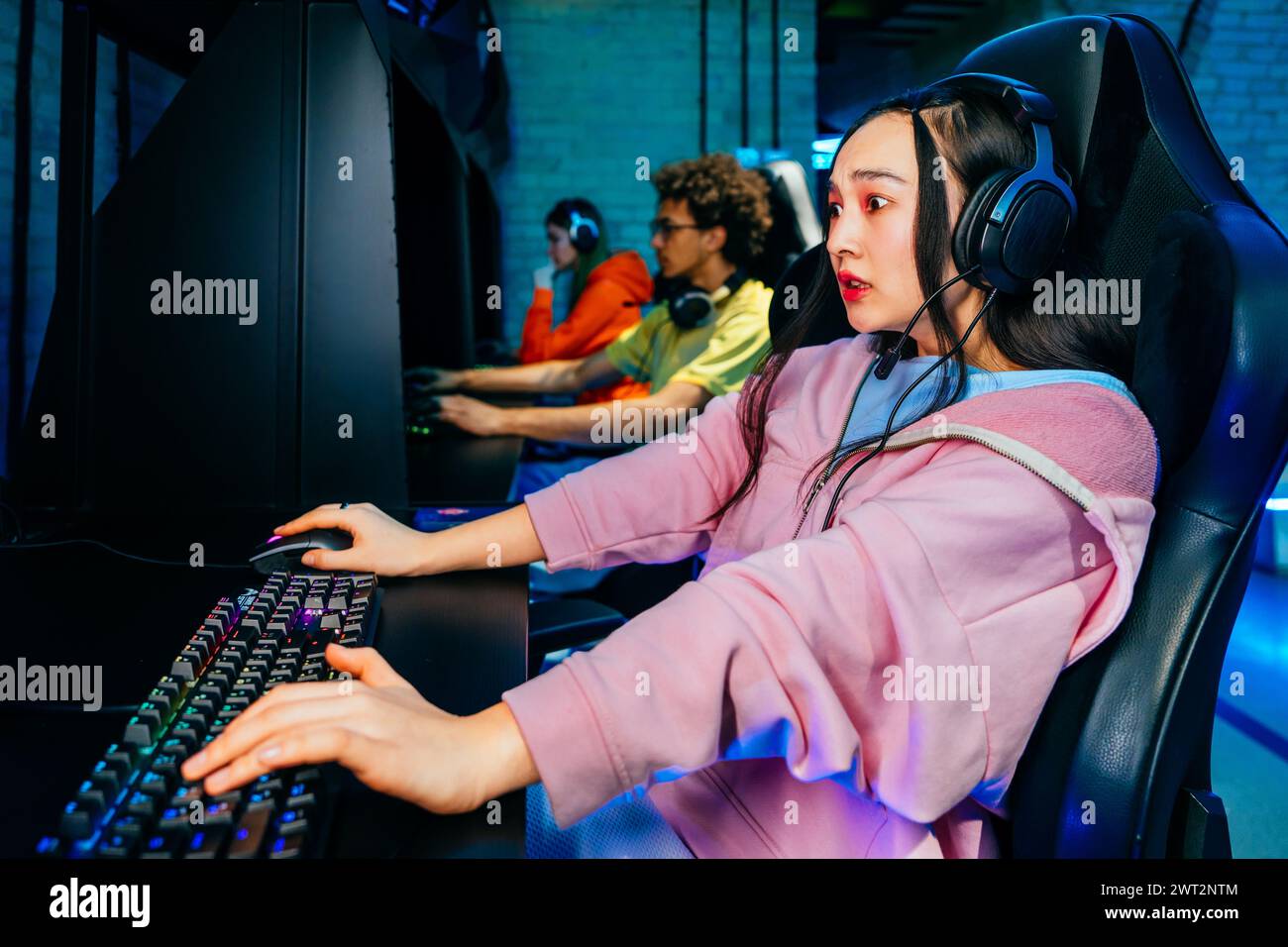 Multiethnic group of young friends playing videogames - Team of ...