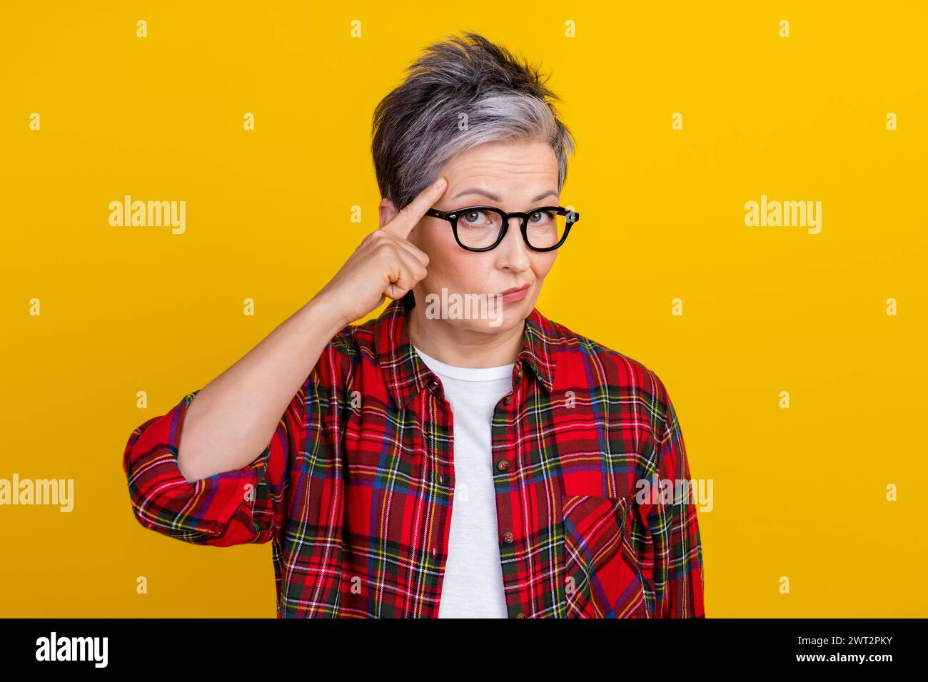 Photo of aged lady finger touch head temple think about it mocking ...