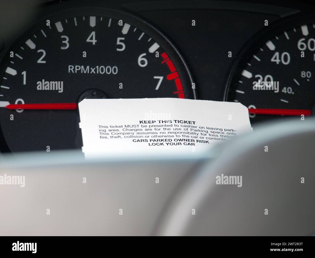 Parking ticket in the dashboard of a vehicle Stock Photo - Alamy