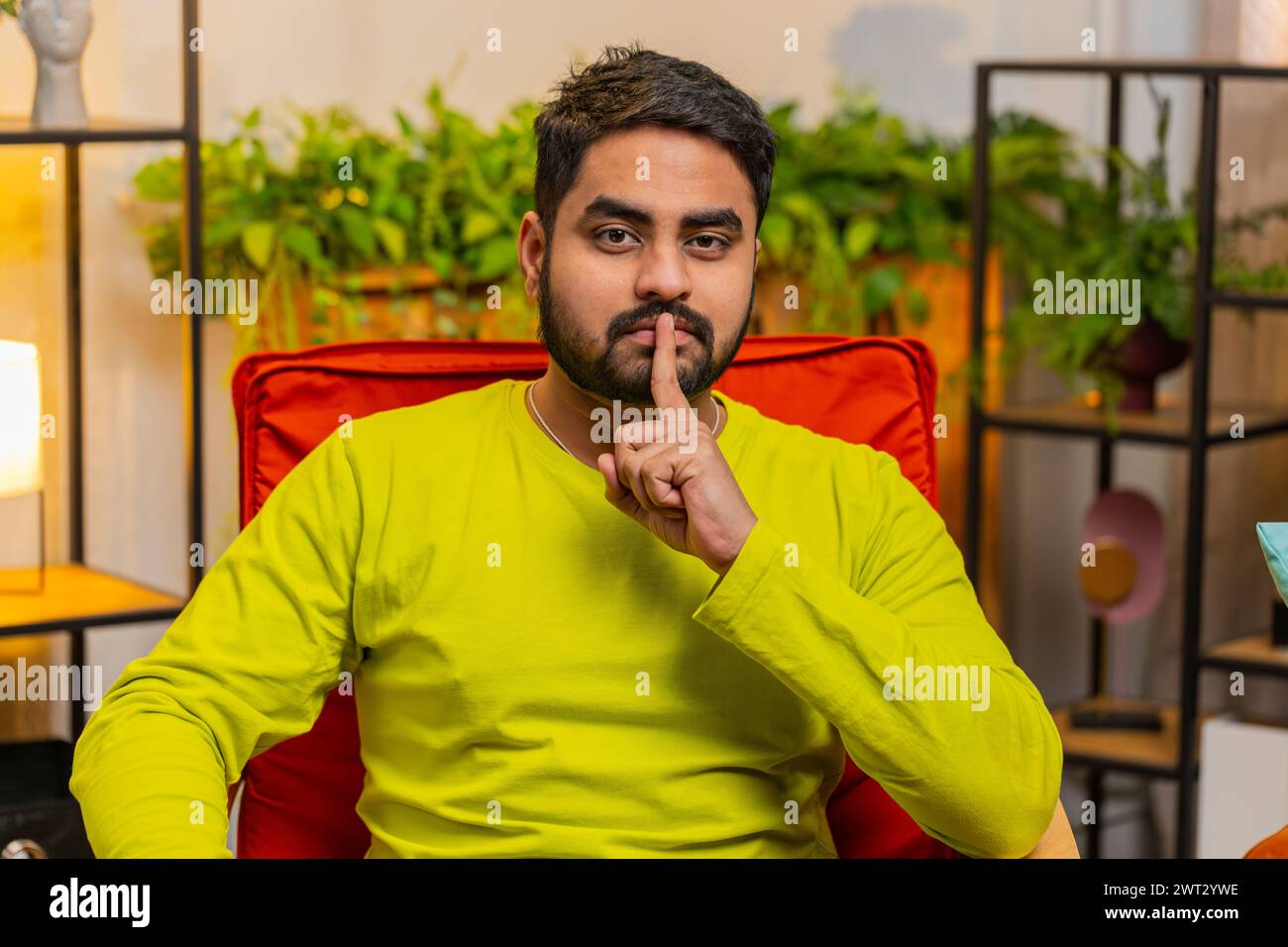 Shh be quiet please. Indian Hindu confident man presses index finger to ...