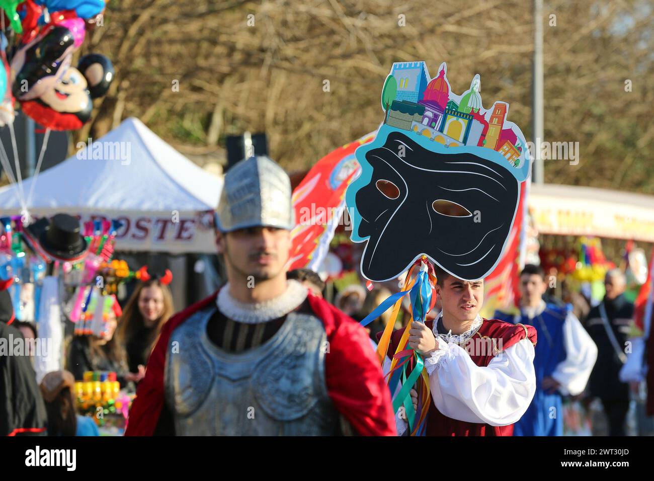 Two men with carnival masks during the carnival parade, in the ancient ...