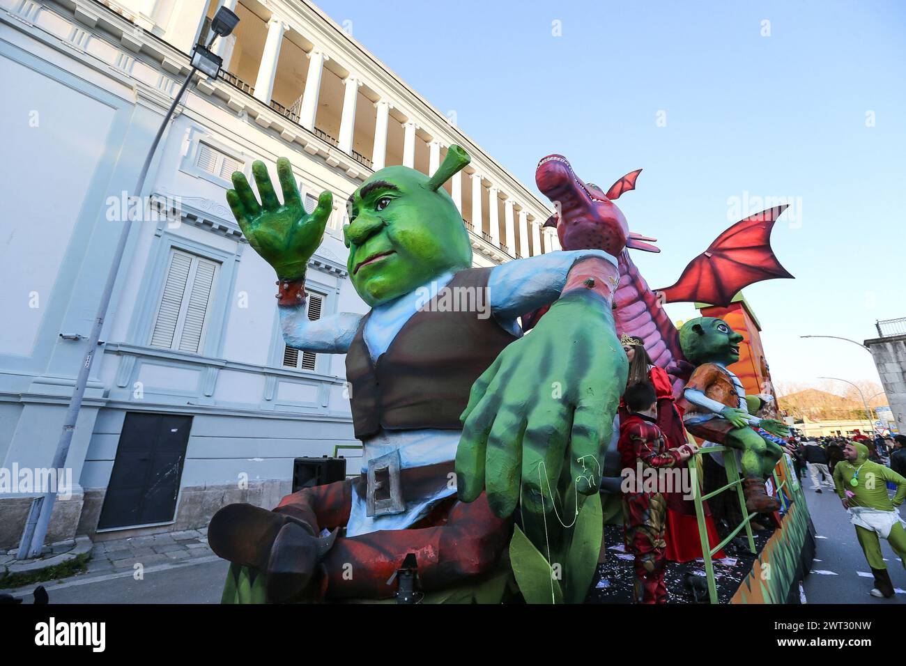 A wagon with statues of Shrek and a dragon during the carnival parade ...