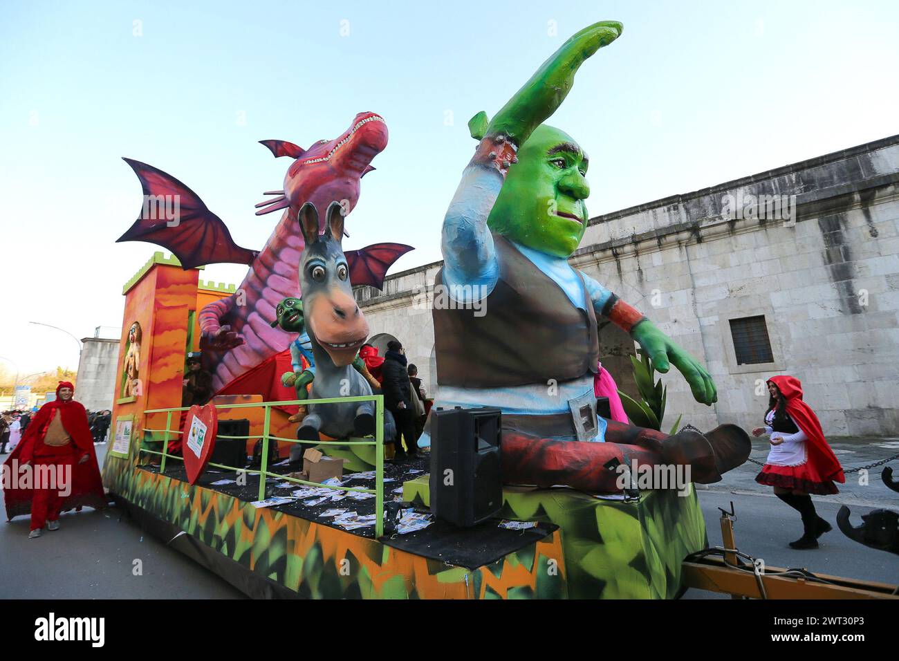 A wagon with statues of Shrek and a dragon during the carnival parade ...
