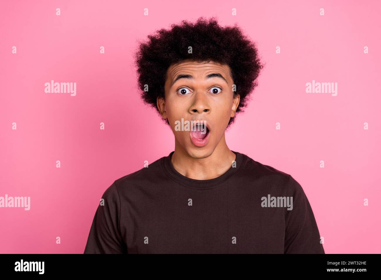Portrait of young student guy open mouth when saw his exam test results ...