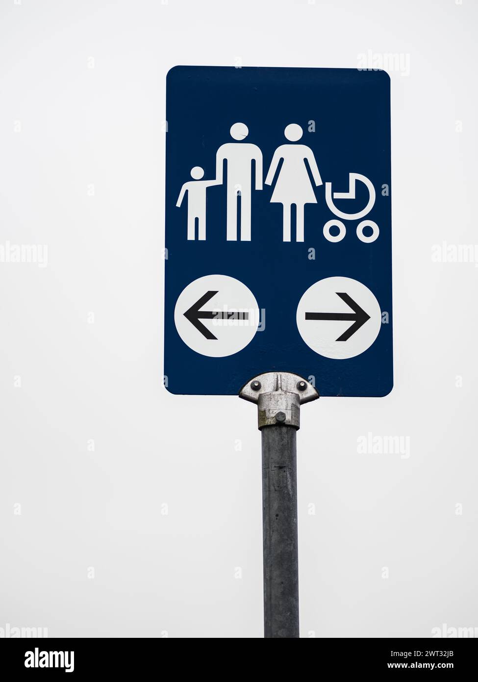 A blue and white sign displays symbols representing a family, including ...