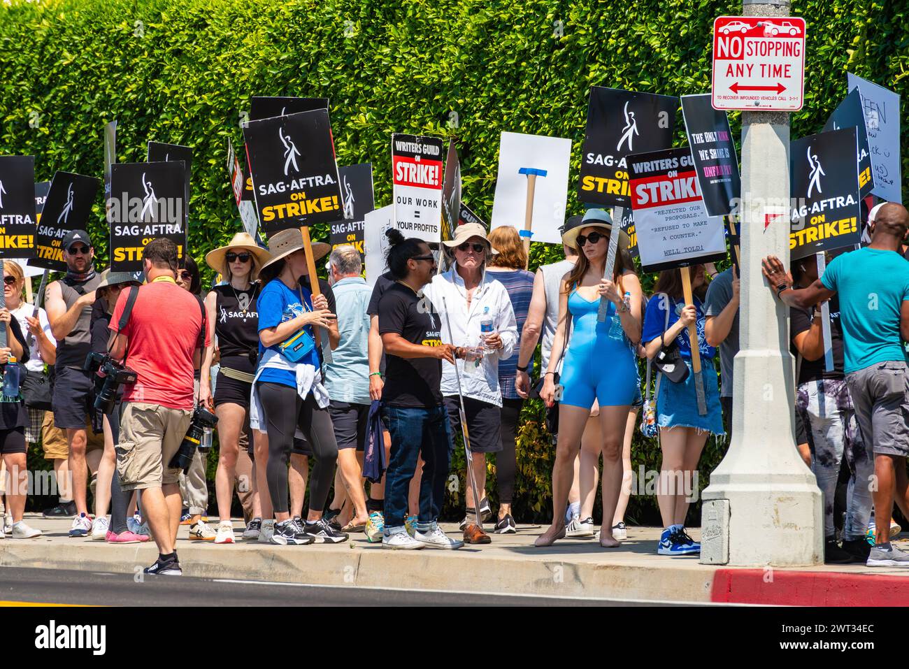 A wide-angle of Blanca Blanco and John Savage standing in the picket ...