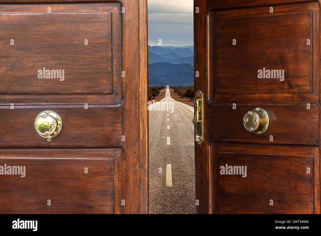 Open door with a straight road going towards the horizon. In the ...