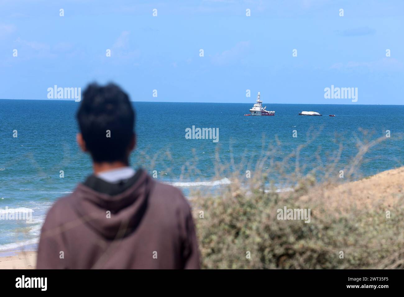 Gaza, Gaza. 15th Mar, 2024. A Palestinian young man watch The Open Arms ...