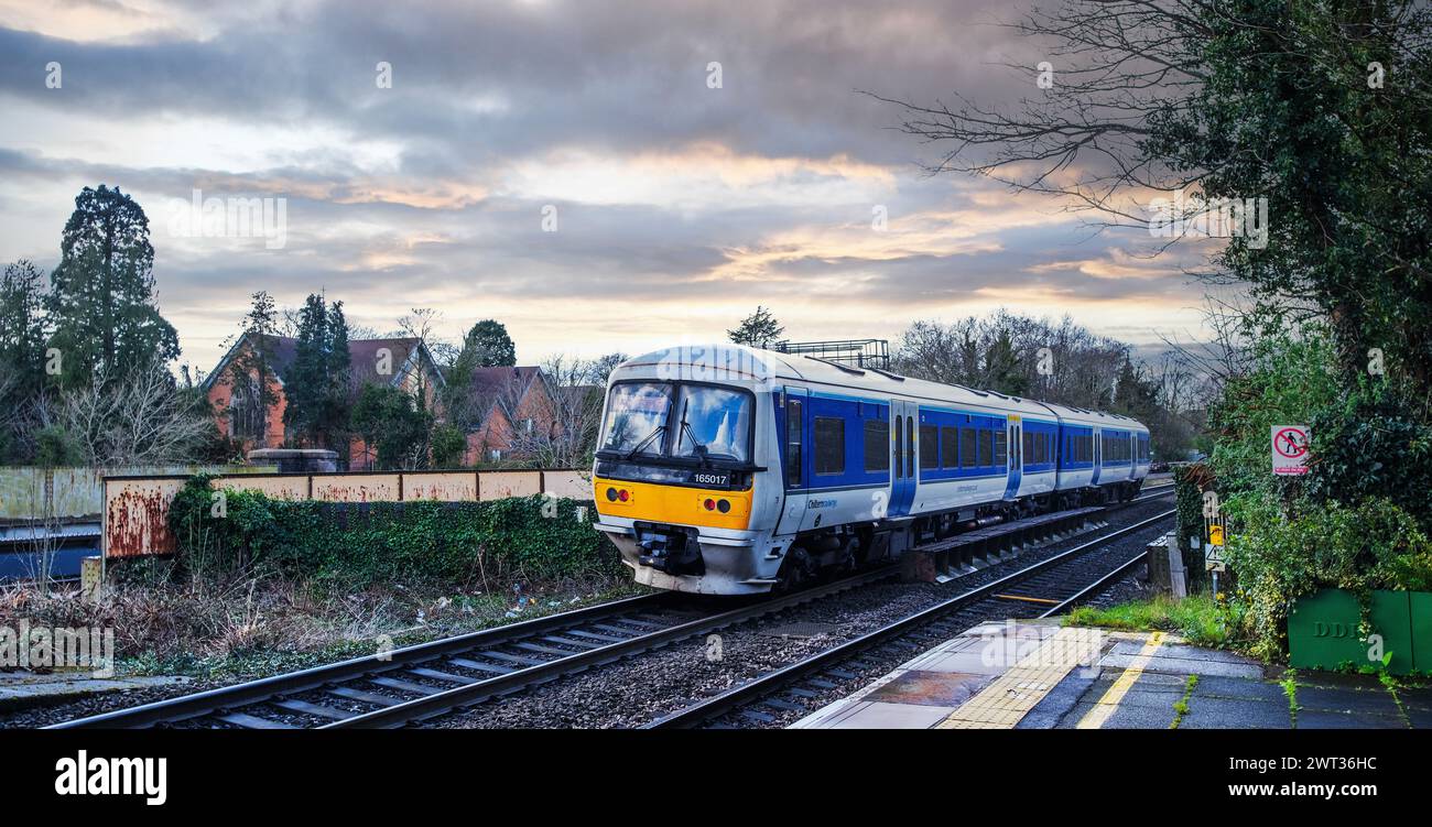 Diesel powered passenger commuter railway train and station. West ...