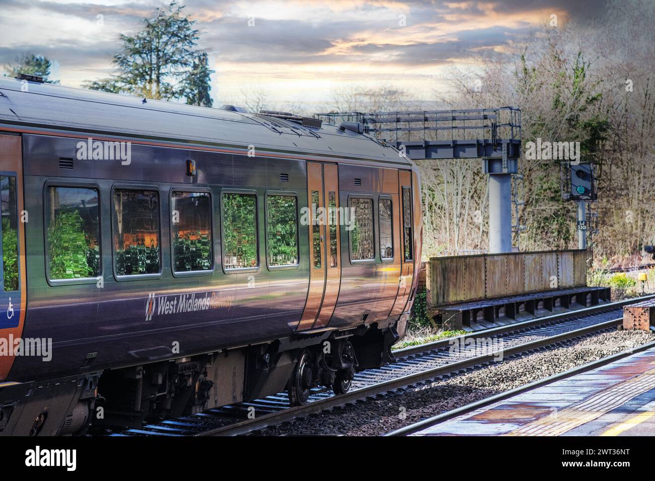 Diesel powered passenger commuter railway train and station. West ...
