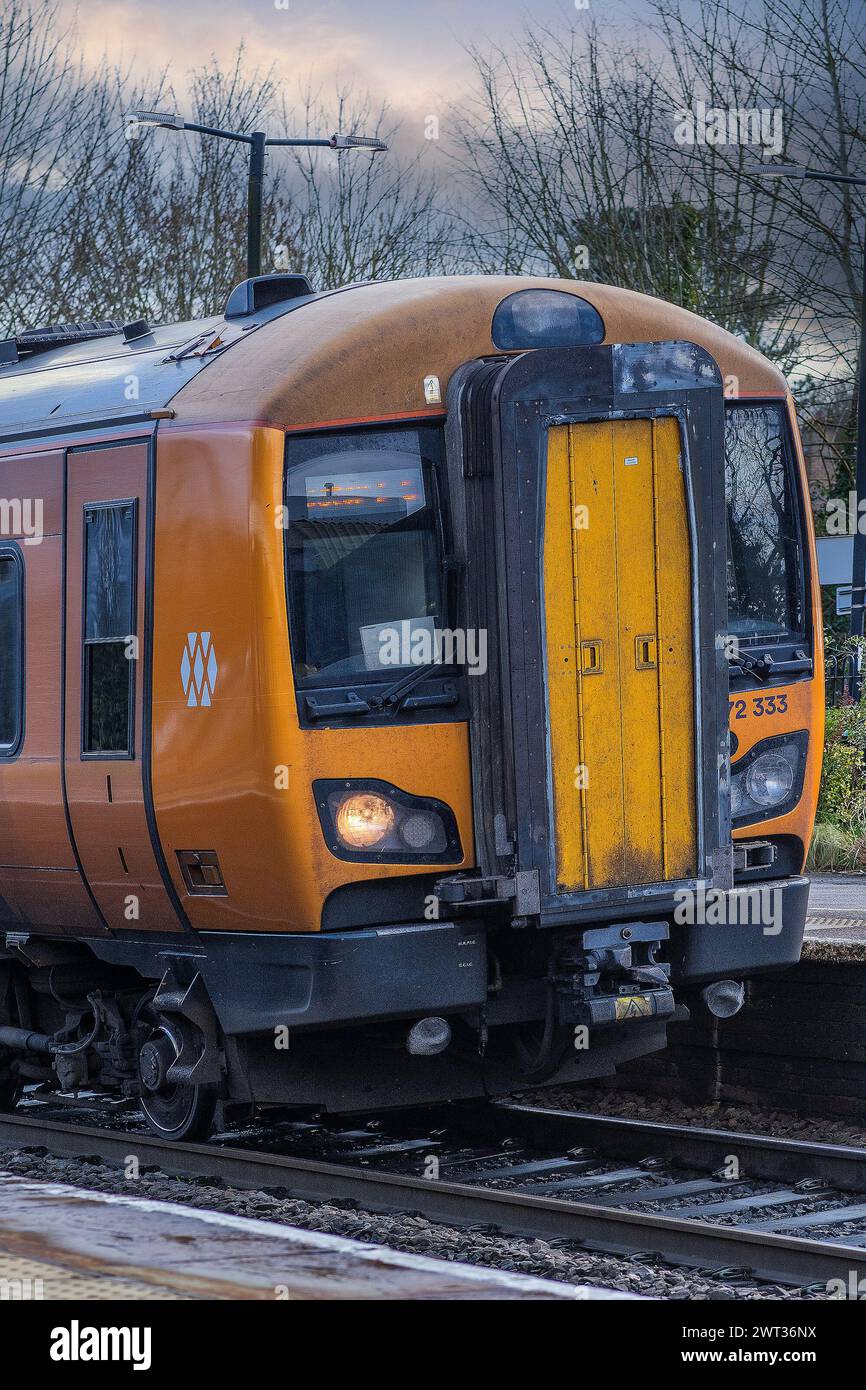Diesel powered passenger commuter railway train and station. West ...