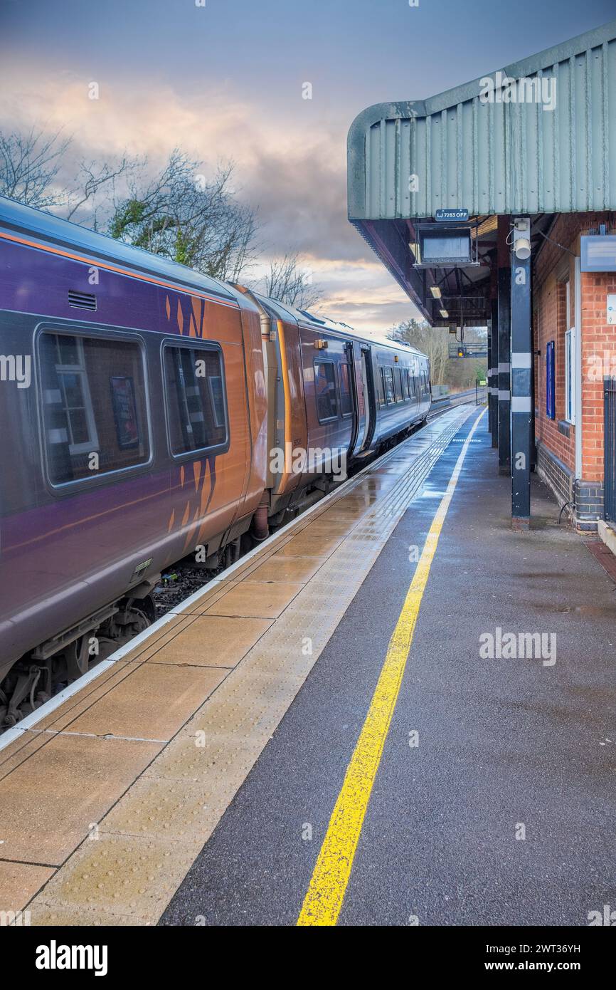 Diesel powered passenger commuter railway train and station. West ...