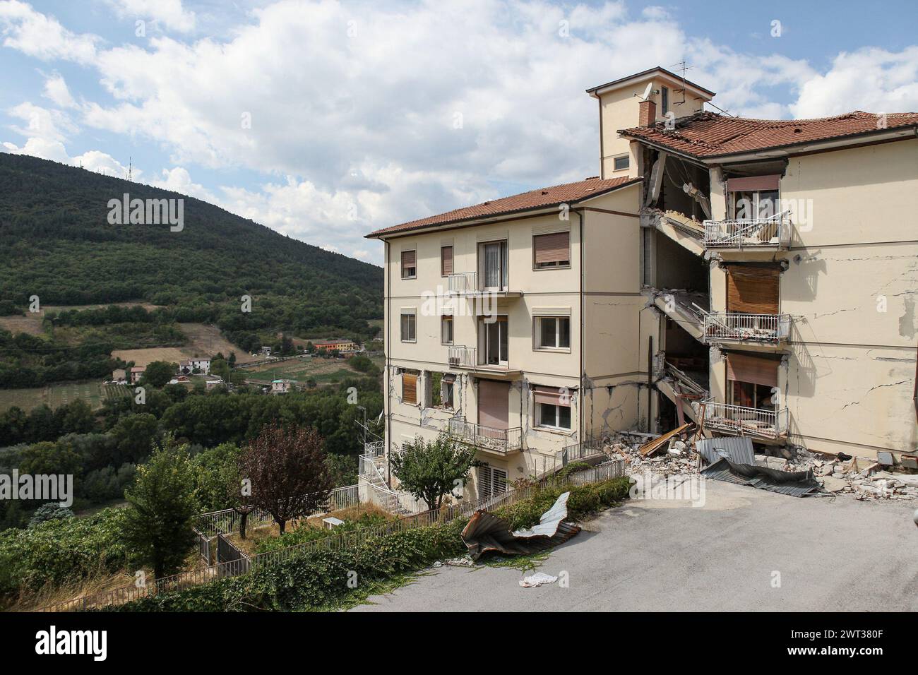 A partially collapsed house, waiting reconstruction, about a year after ...